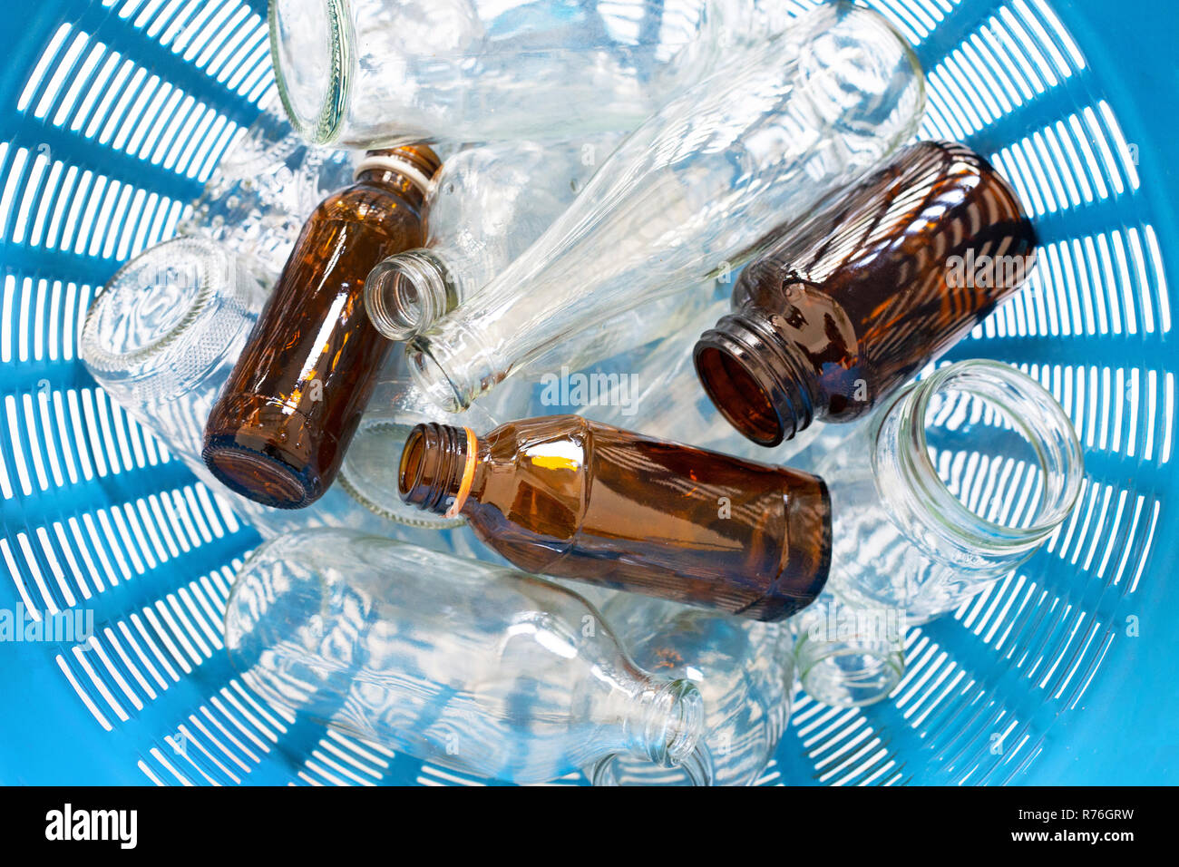 Glass bottles in waste basket Stock Photo - Alamy