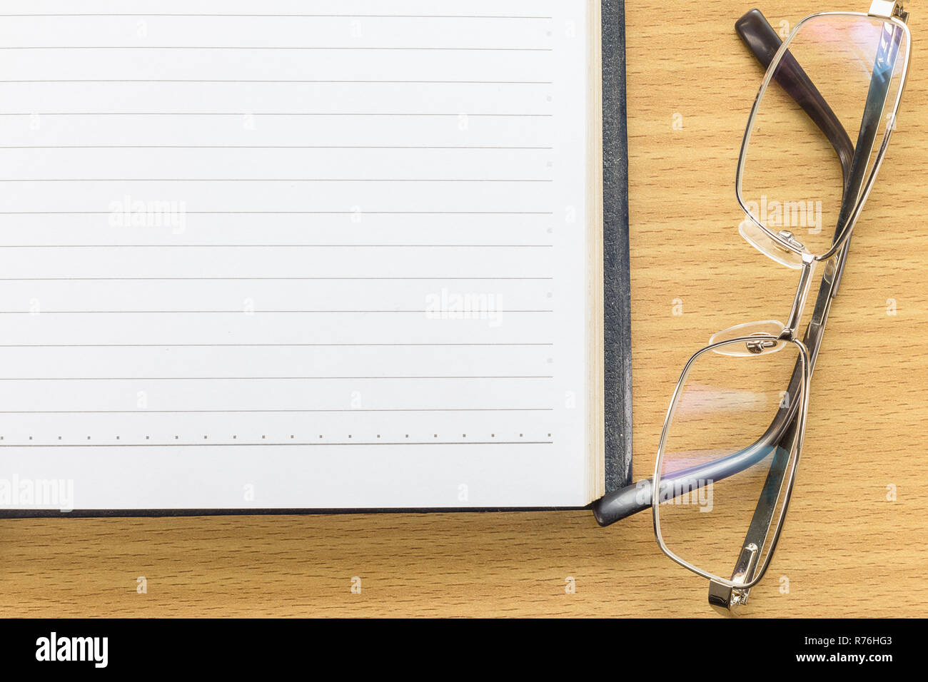 Notebook open blank page and Eyeglasses Stock Photo - Alamy