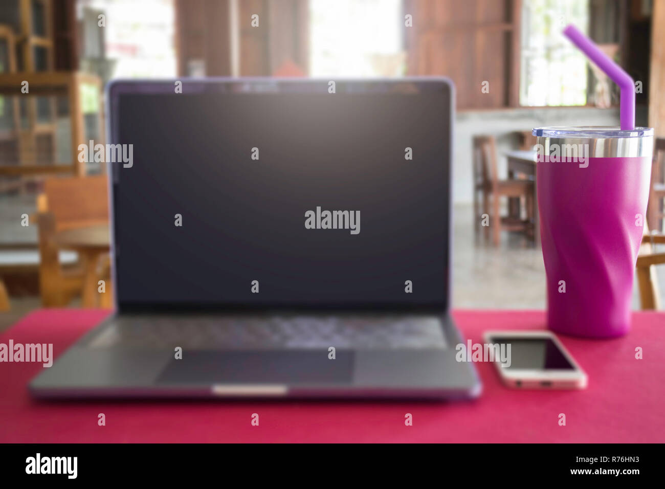Simple wireless work table with mobile gadget and drink Stock Photo - Alamy