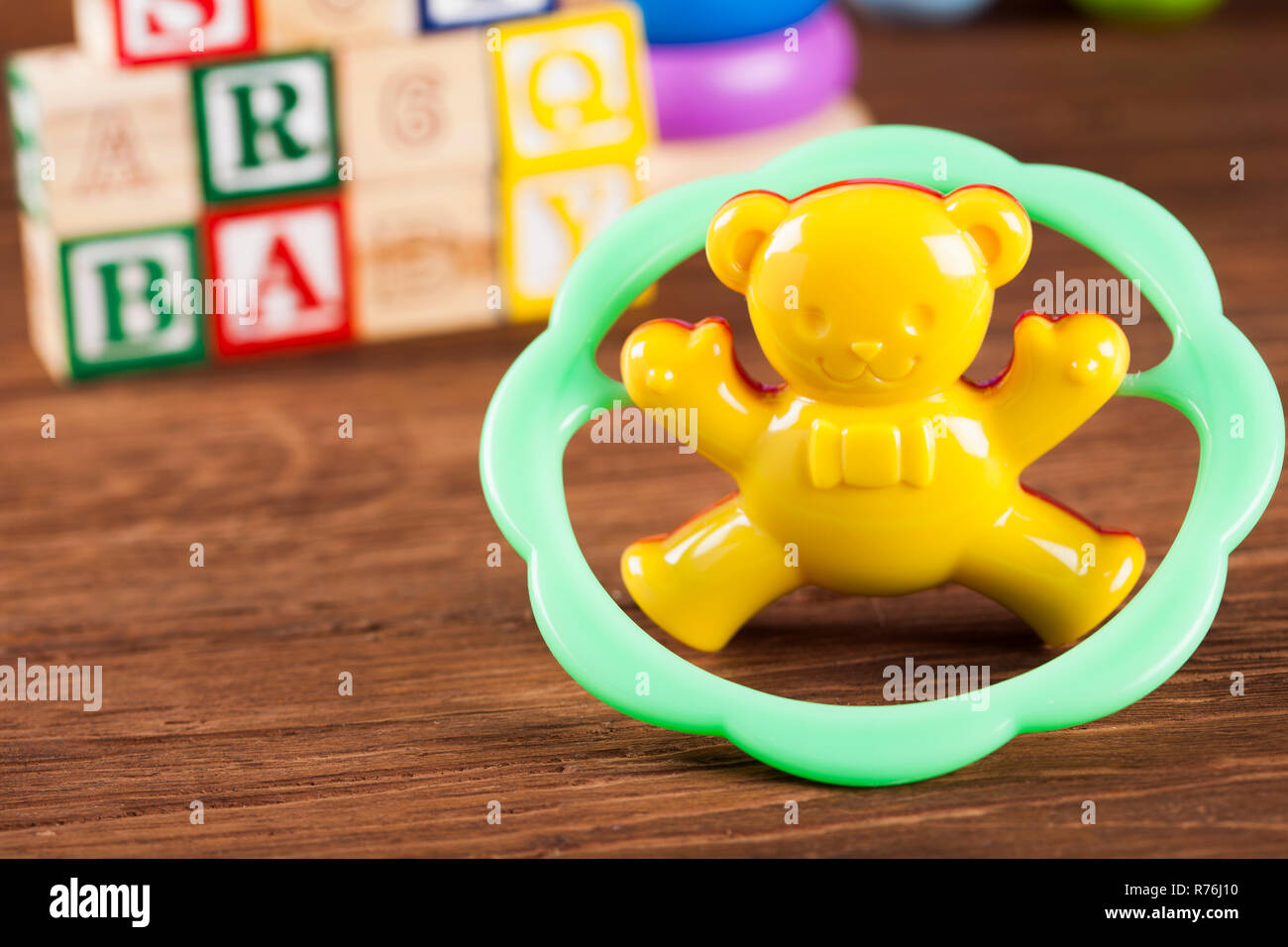 Baby World toy collection on on wooden background Stock Photo - Alamy