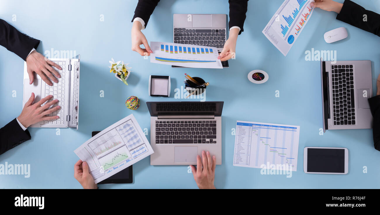 Businesspeople Analyzing Graphs Stock Photo - Alamy