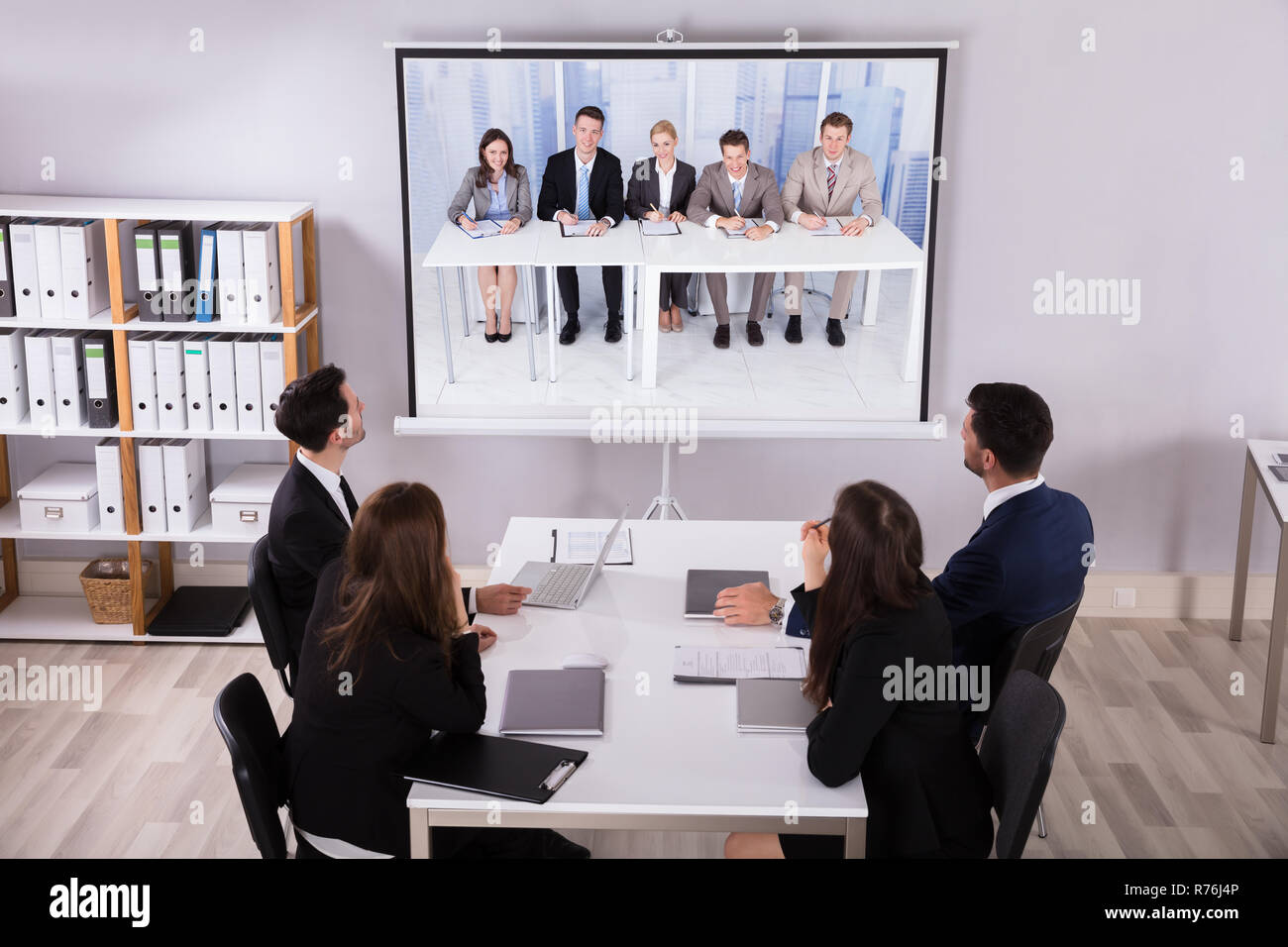 Group businesspeople files sitting hi-res stock photography and images ...