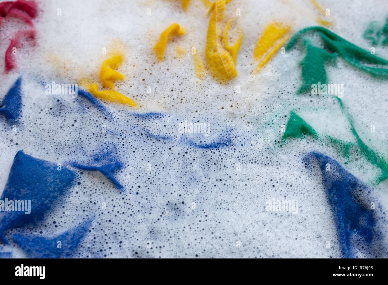 Washing clothes, colorful clothes soaked Stock Photo - Alamy