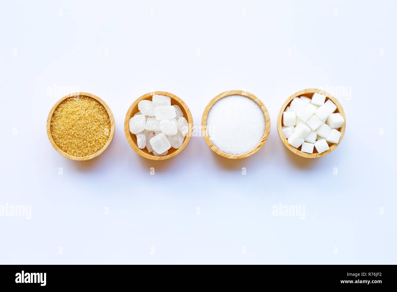 Various types of sugar on white background Stock Photo - Alamy