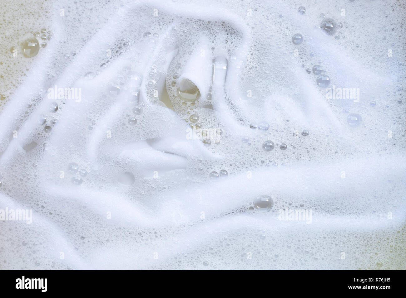 Washing clothes, white clothes soaked Stock Photo - Alamy