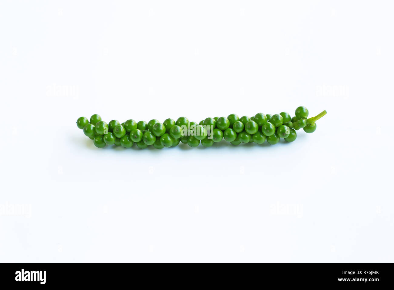 Fresh green peppercorns on white background Stock Photo - Alamy