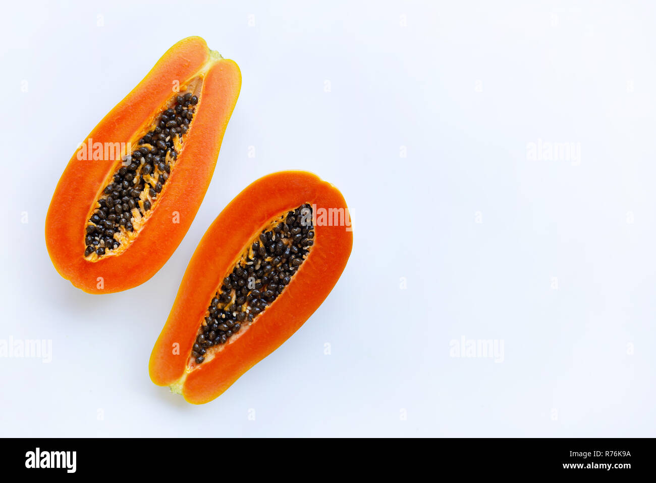 Half of ripe papaya fruit with seeds isolated on white background Stock ...