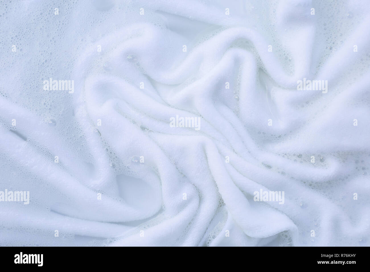 Soak a cloth before washing, white cloth Stock Photo - Alamy