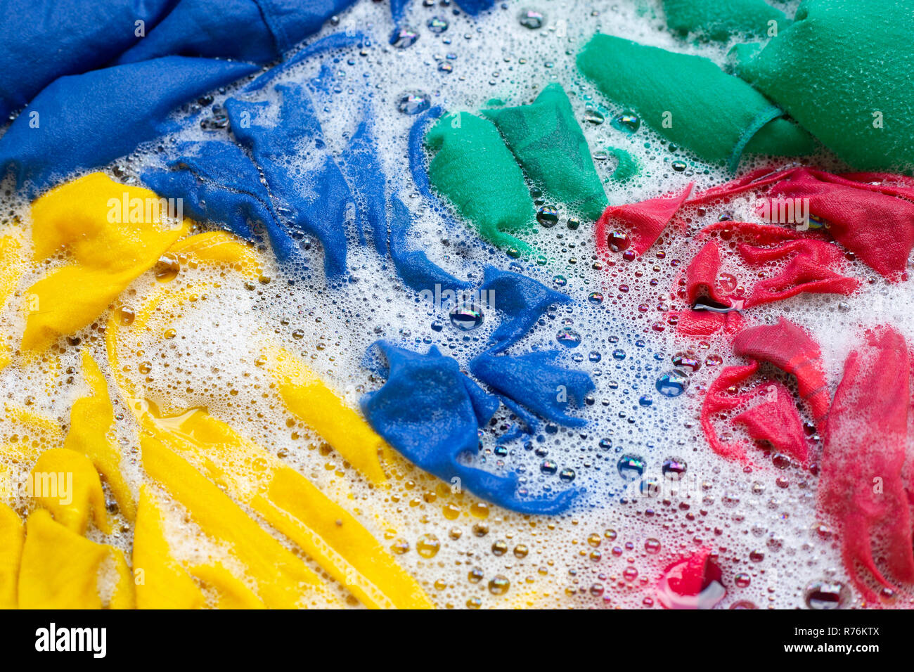 Washing clothes, colorful clothes soaked Stock Photo - Alamy