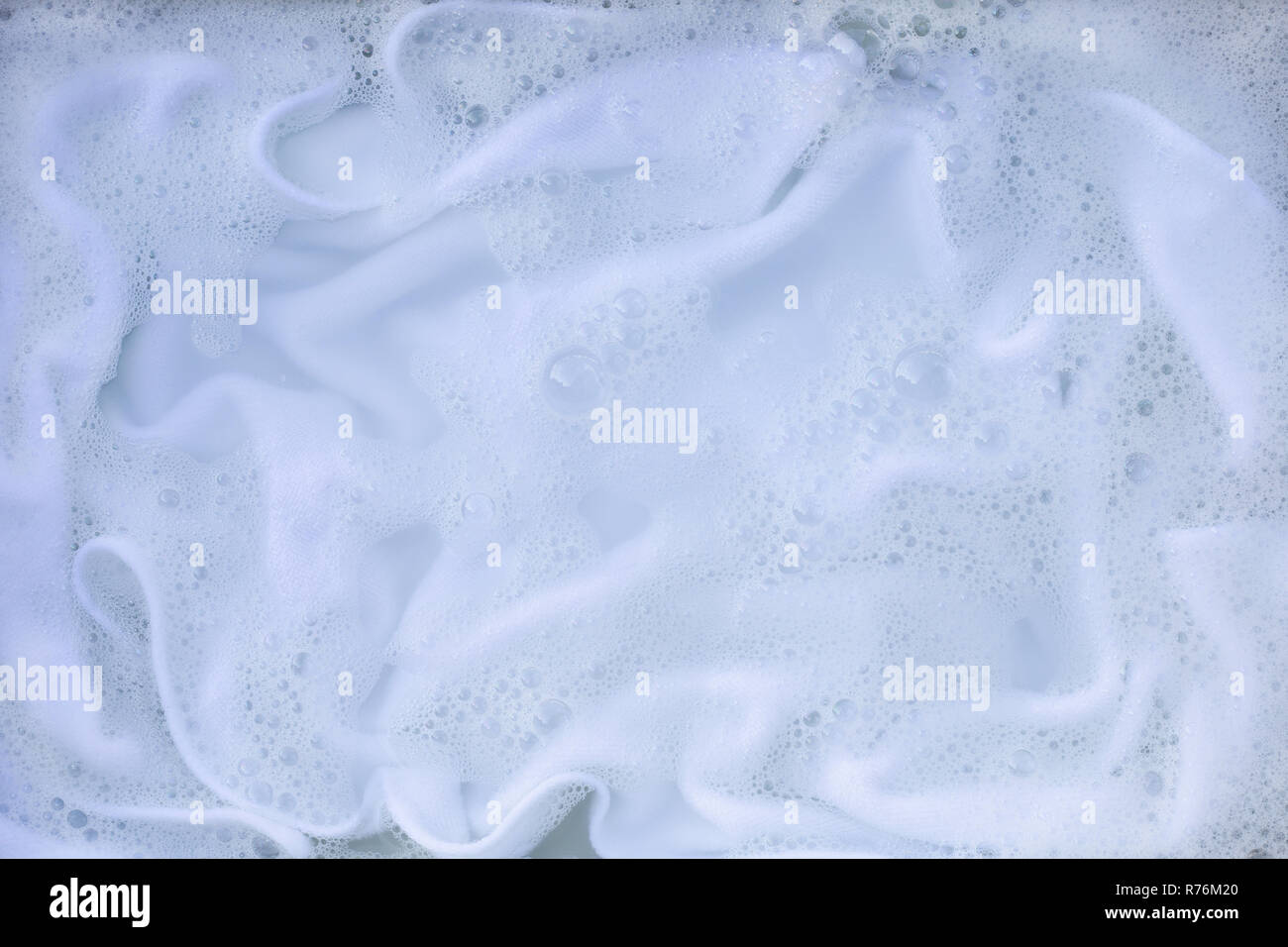 Soak a cloth before washing, white cloth Stock Photo - Alamy