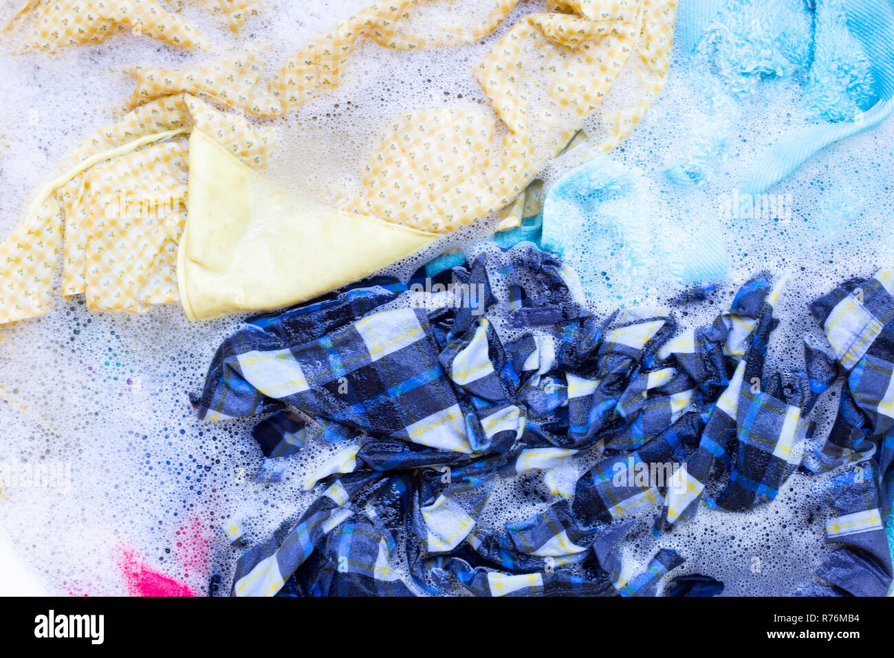 Washing clothes, colorful clothes soaked Stock Photo - Alamy