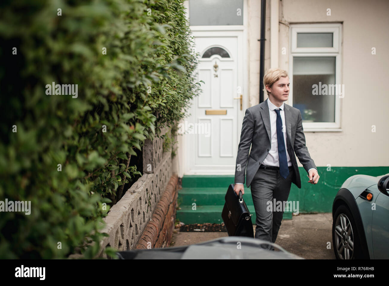 Businessman Leaving to go to Work Stock Photo - Alamy