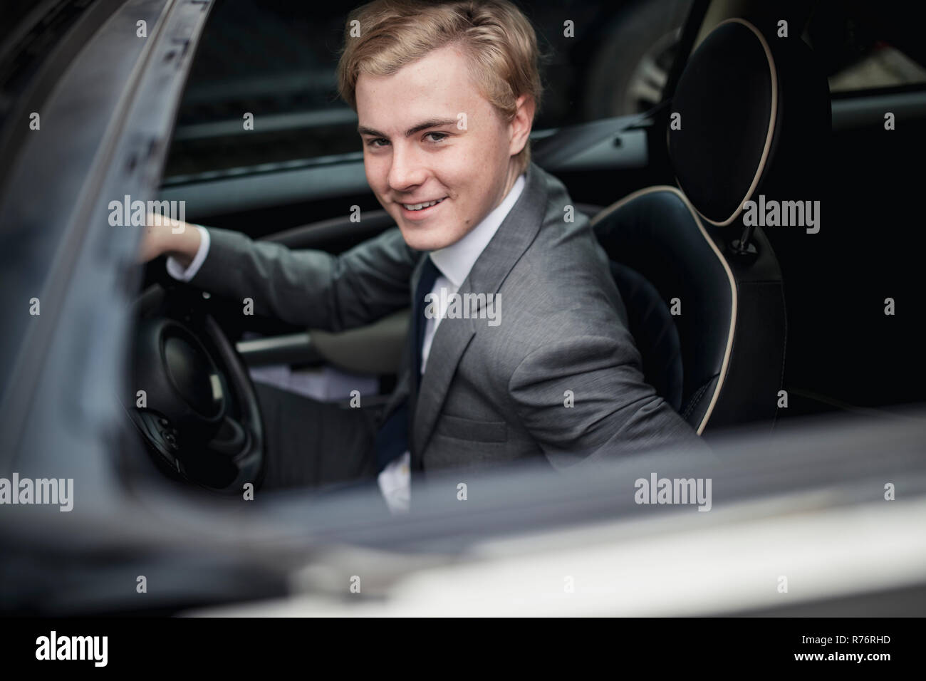 Businessman Driving into Work Stock Photo - Alamy