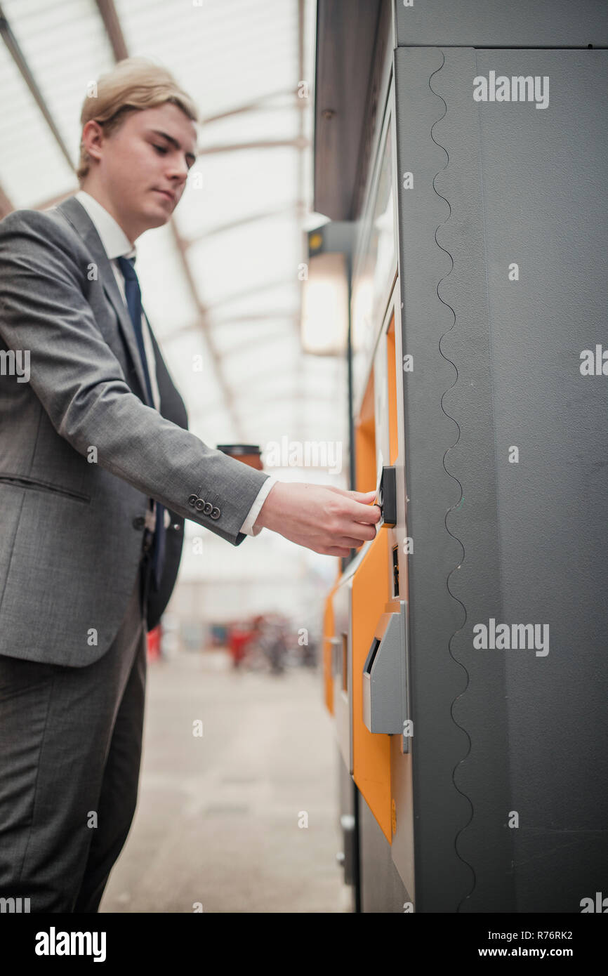 Man using train ticket machine hi-res stock photography and images - Alamy
