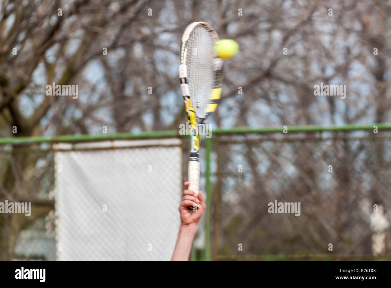Tennis racket hitting a tennis ball Stock Photo - Alamy