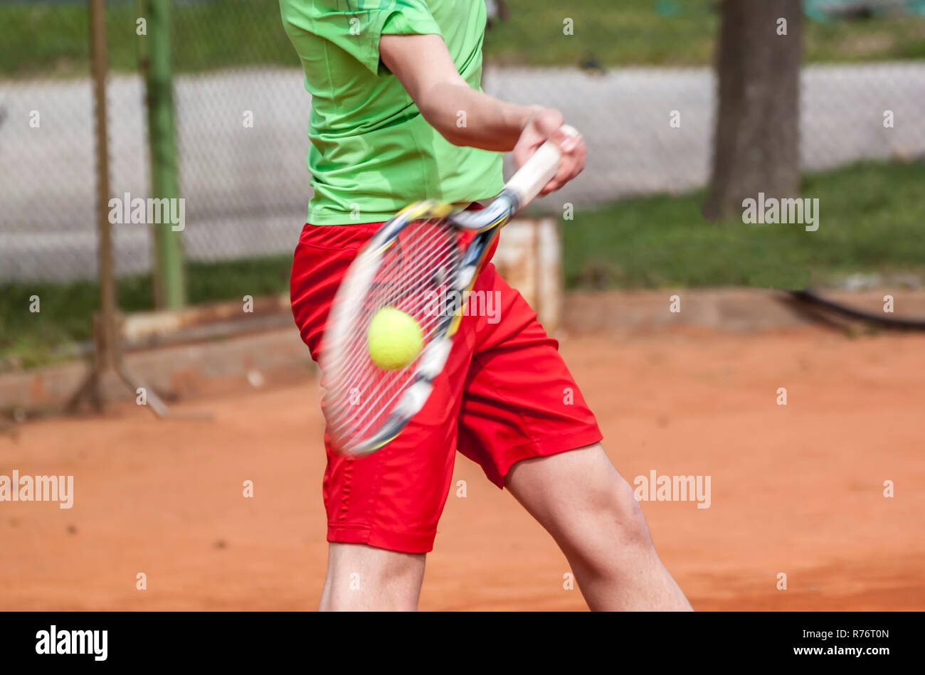Tennis racket cord and ball deforming from the power of a forehand ...