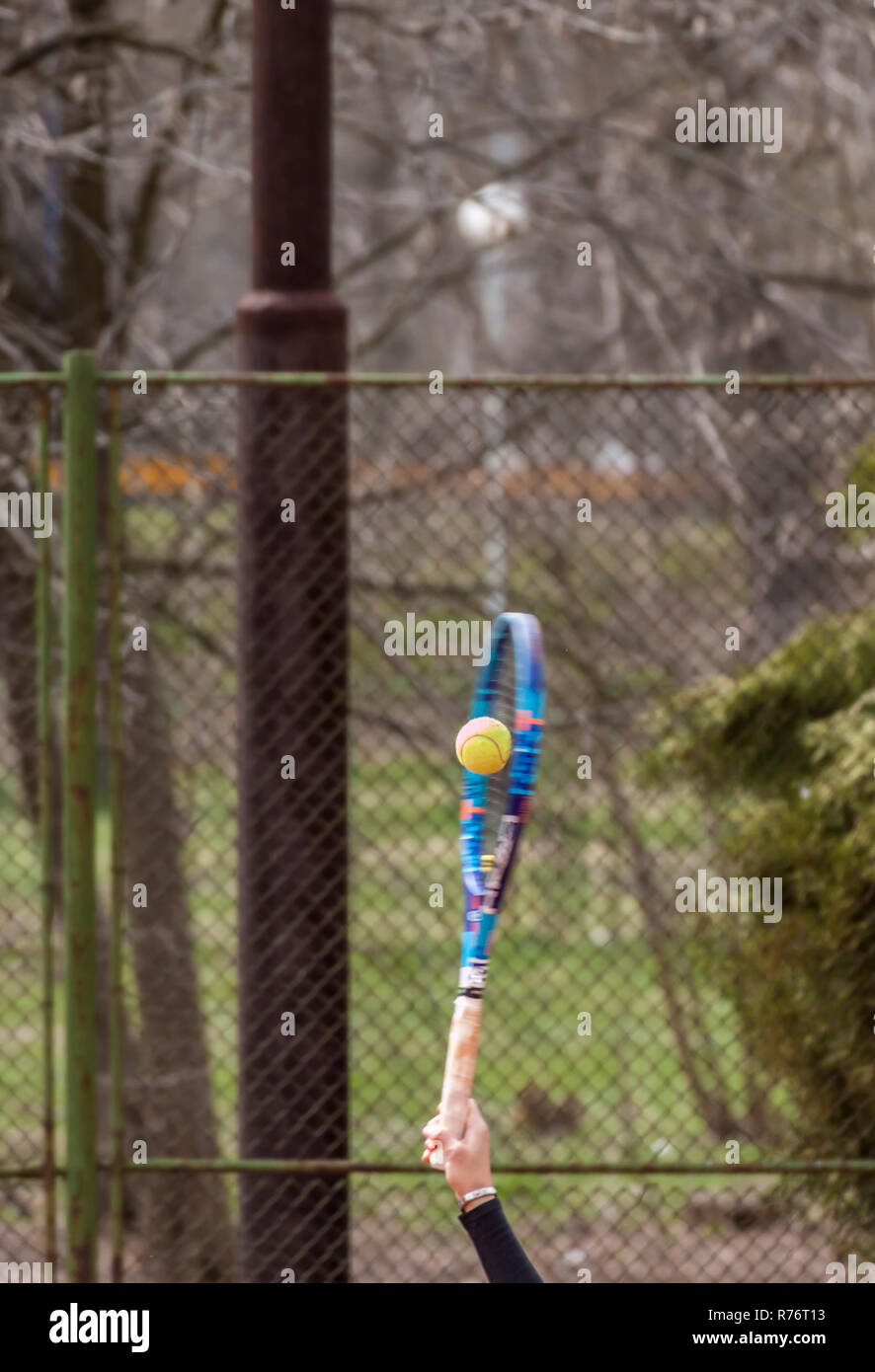 Tennis racket hitting a tennis ball Stock Photo - Alamy