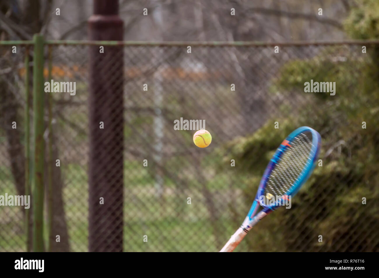 Tennis racket hitting a tennis ball Stock Photo - Alamy