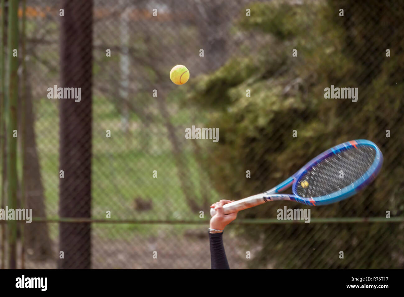 Tennis racket hitting a tennis ball Stock Photo - Alamy