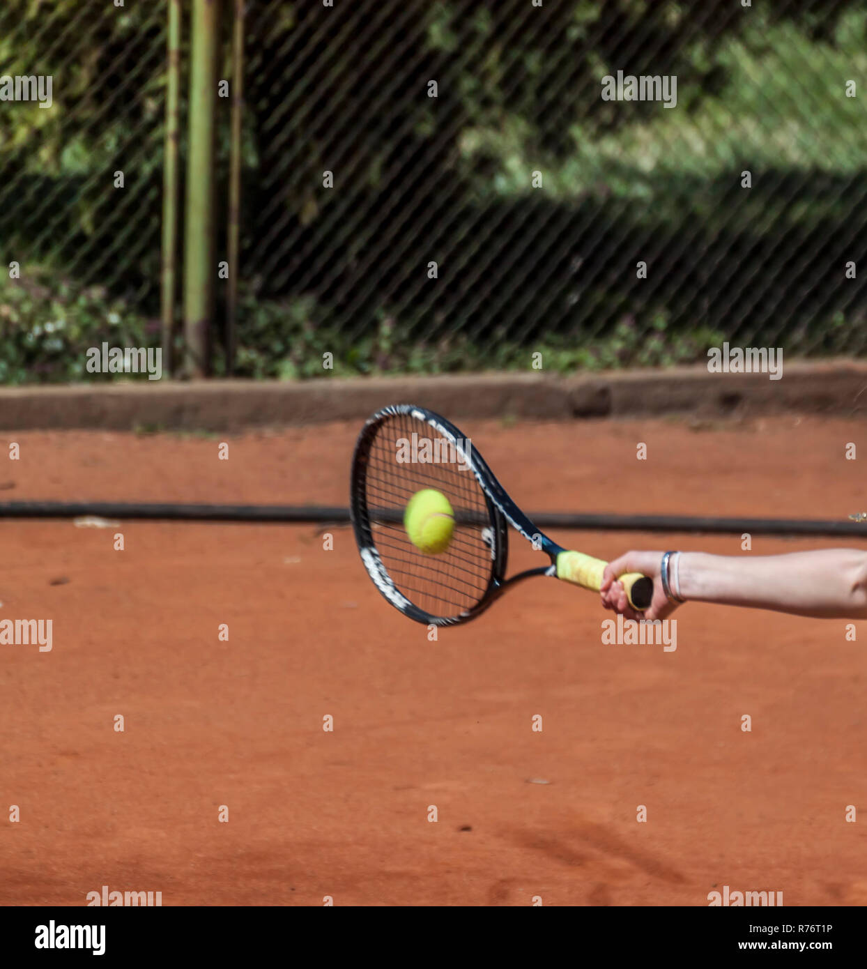 Tennis racket cord and ball deforming from the power of a forehand ...