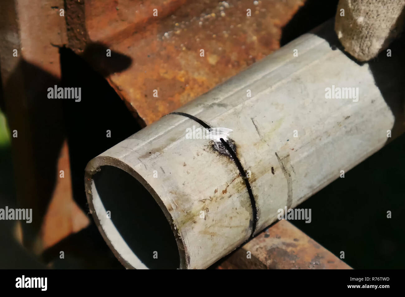 Metal pipe prepared for welding. Preparation of tubes with welding ...