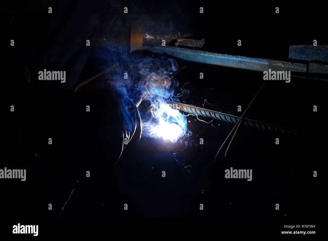 Welding of steel reinforcement. Sparks and light from welding. Electric ...