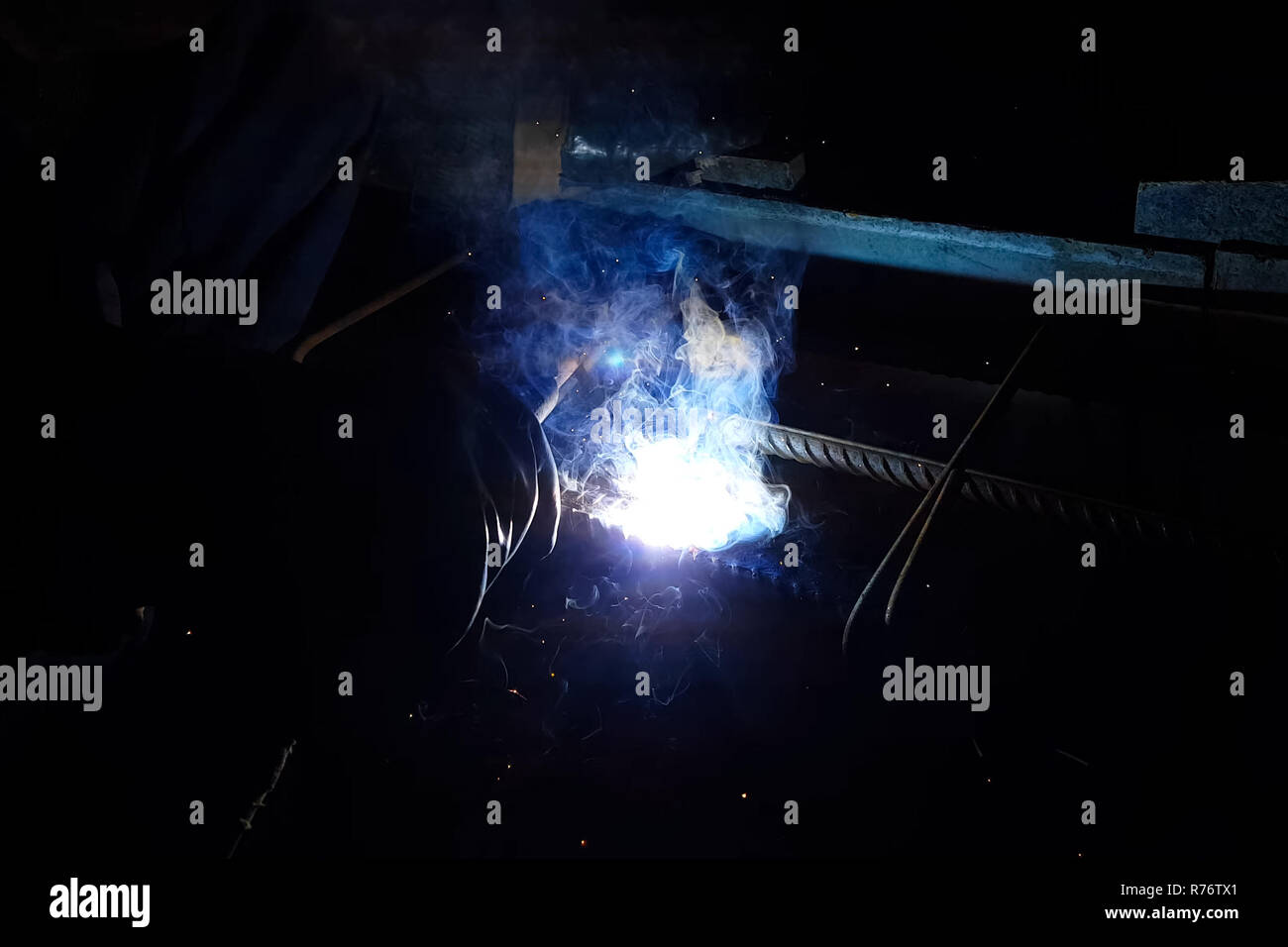 Welding of steel reinforcement. Sparks and light from welding. Electric ...