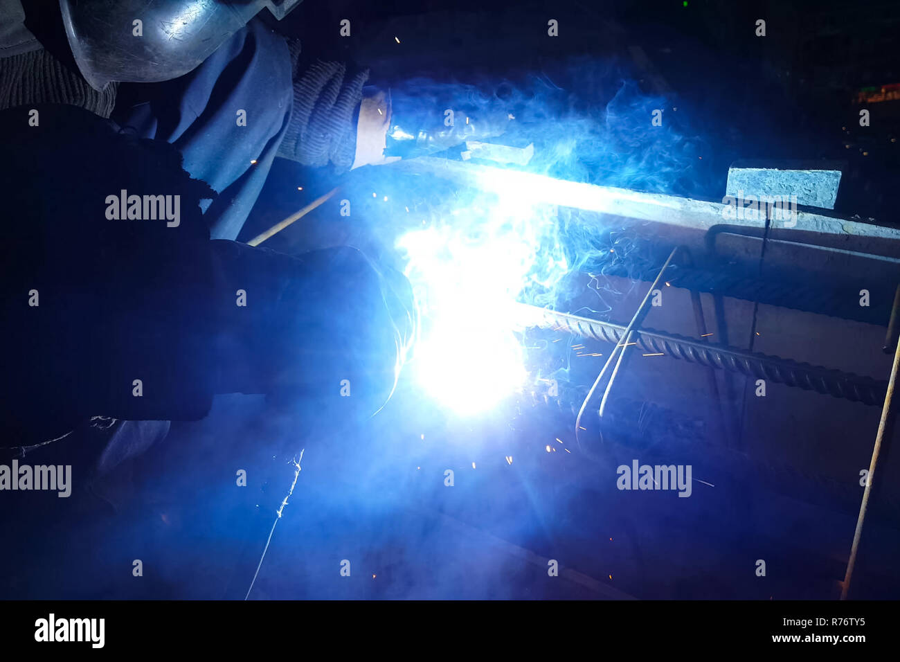 Welding of steel reinforcement. Sparks and light from welding. Electric ...