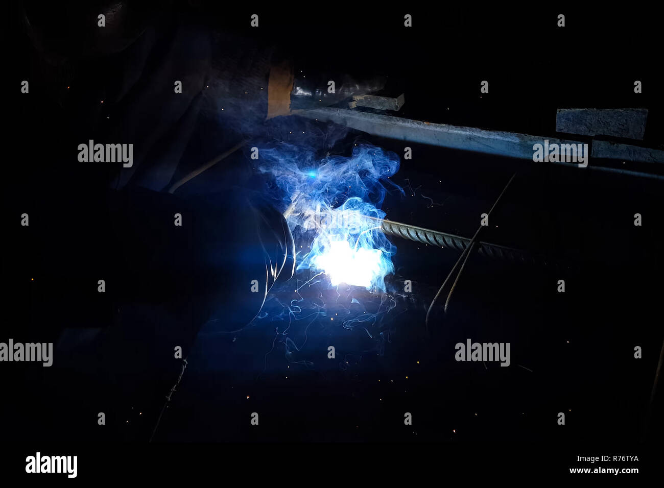 Welding of steel reinforcement. Sparks and light from welding. Electric ...
