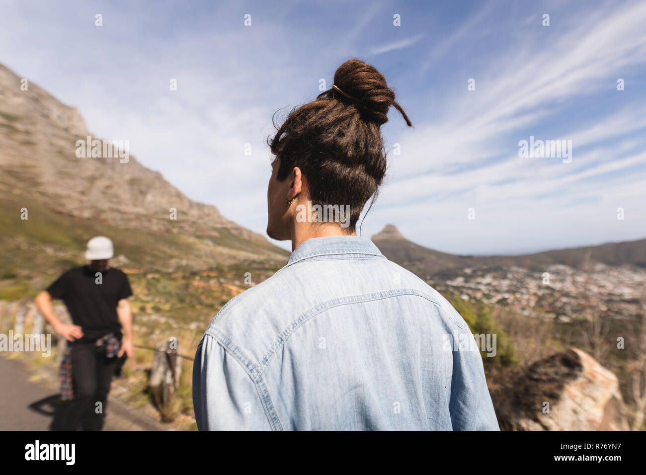 Skateboarder downhill skateboarding on mountain hi-res stock ...