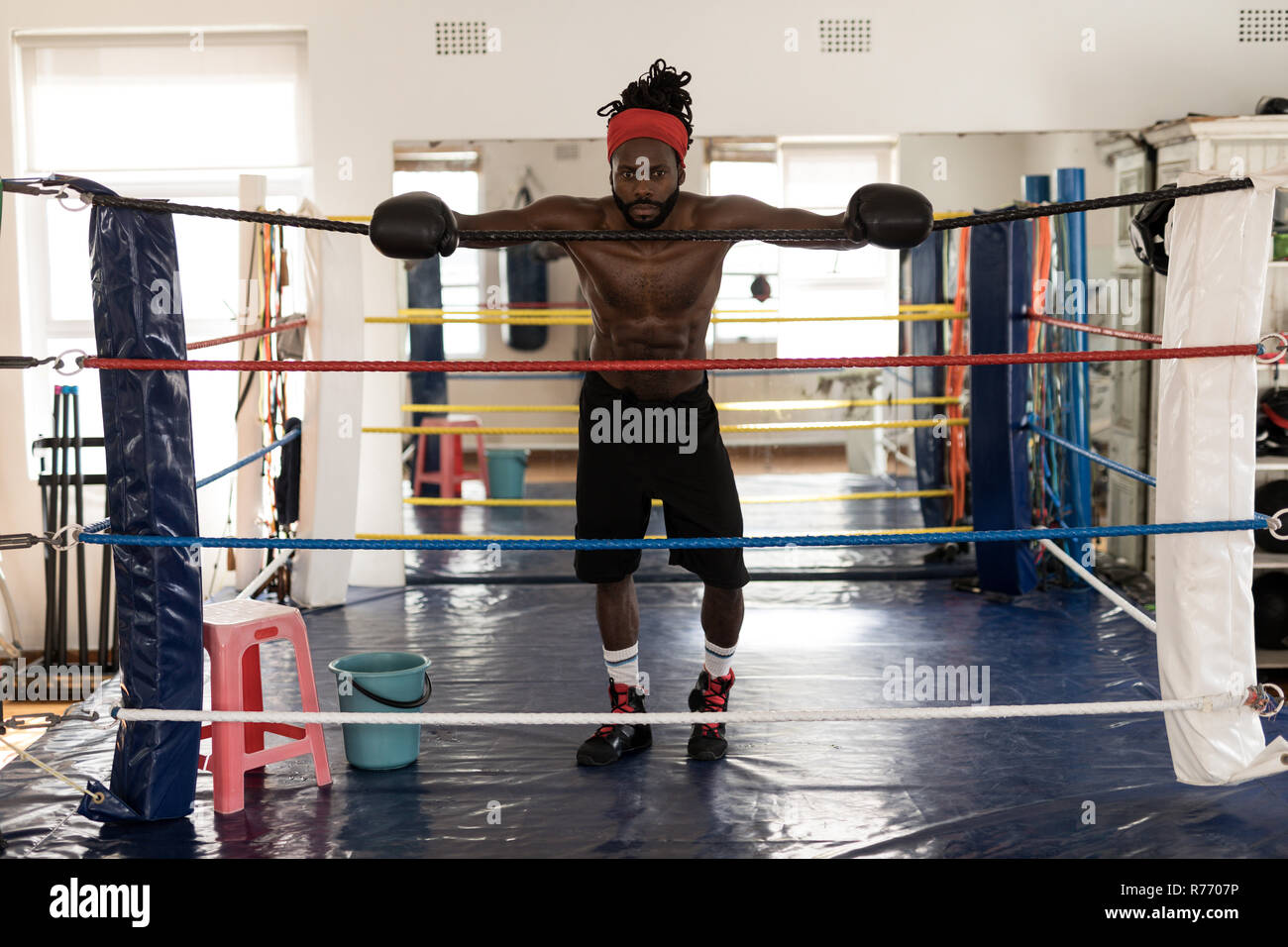 Male boxer standing in boxing ring at fitness studio Stock Photo - Alamy