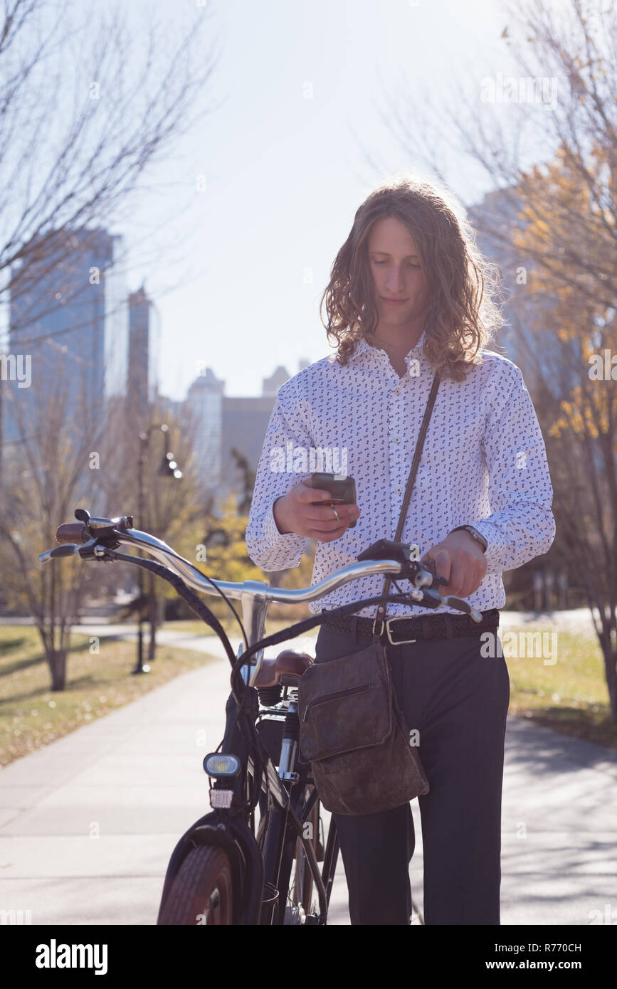 Man walking bicycle hi-res stock photography and images - Alamy