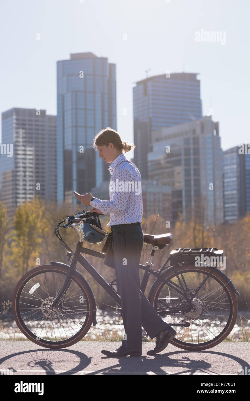 Male walking bicycle on road hi-res stock photography and images - Alamy