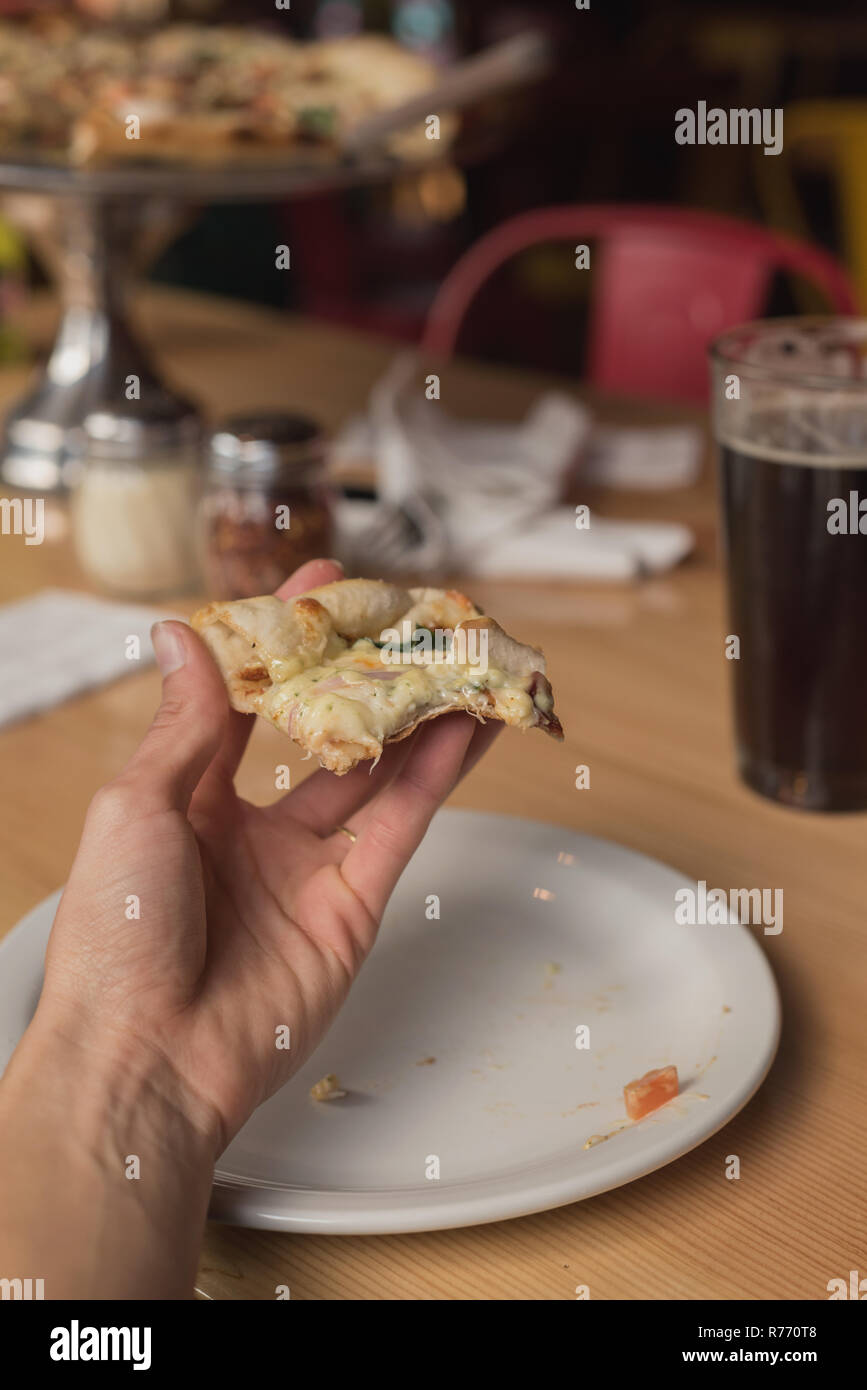 Holding pizza slice hi-res stock photography and images - Alamy