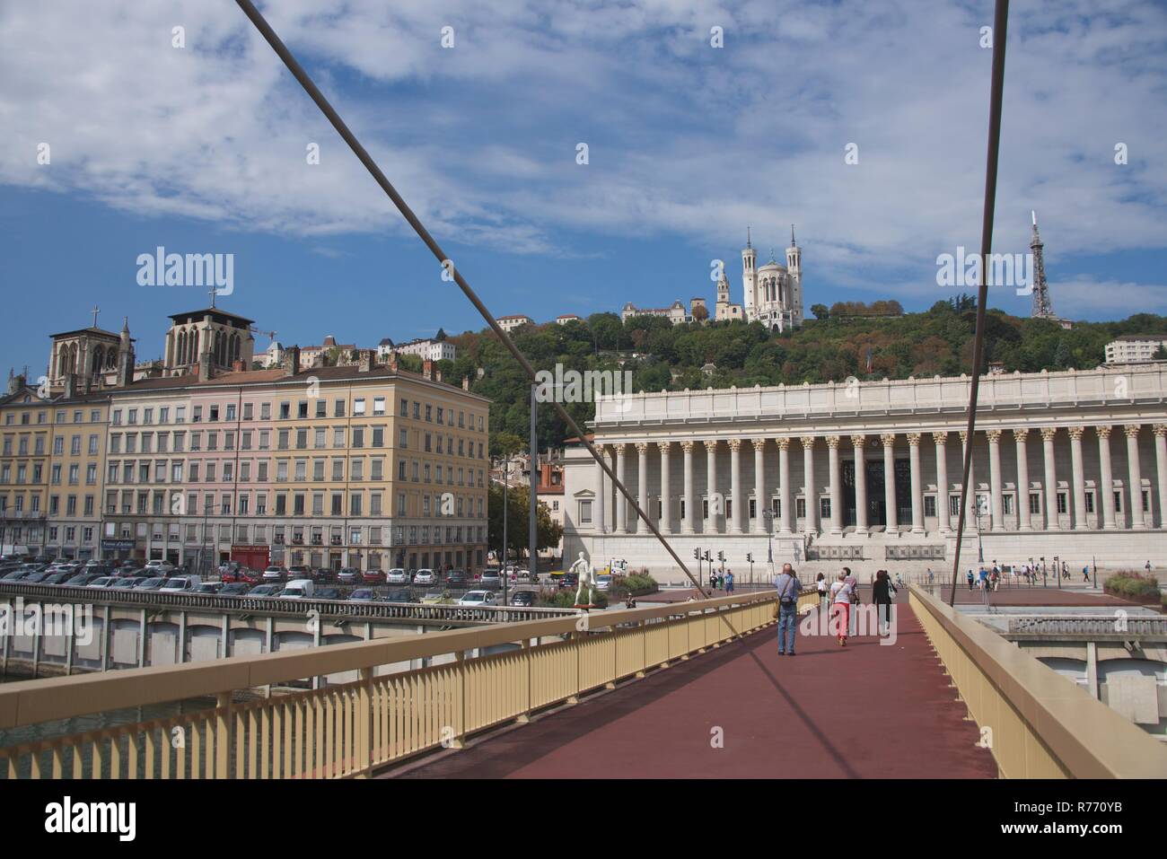Visitors cross one of many pedestrian bridges in Lyon, France Stock ...