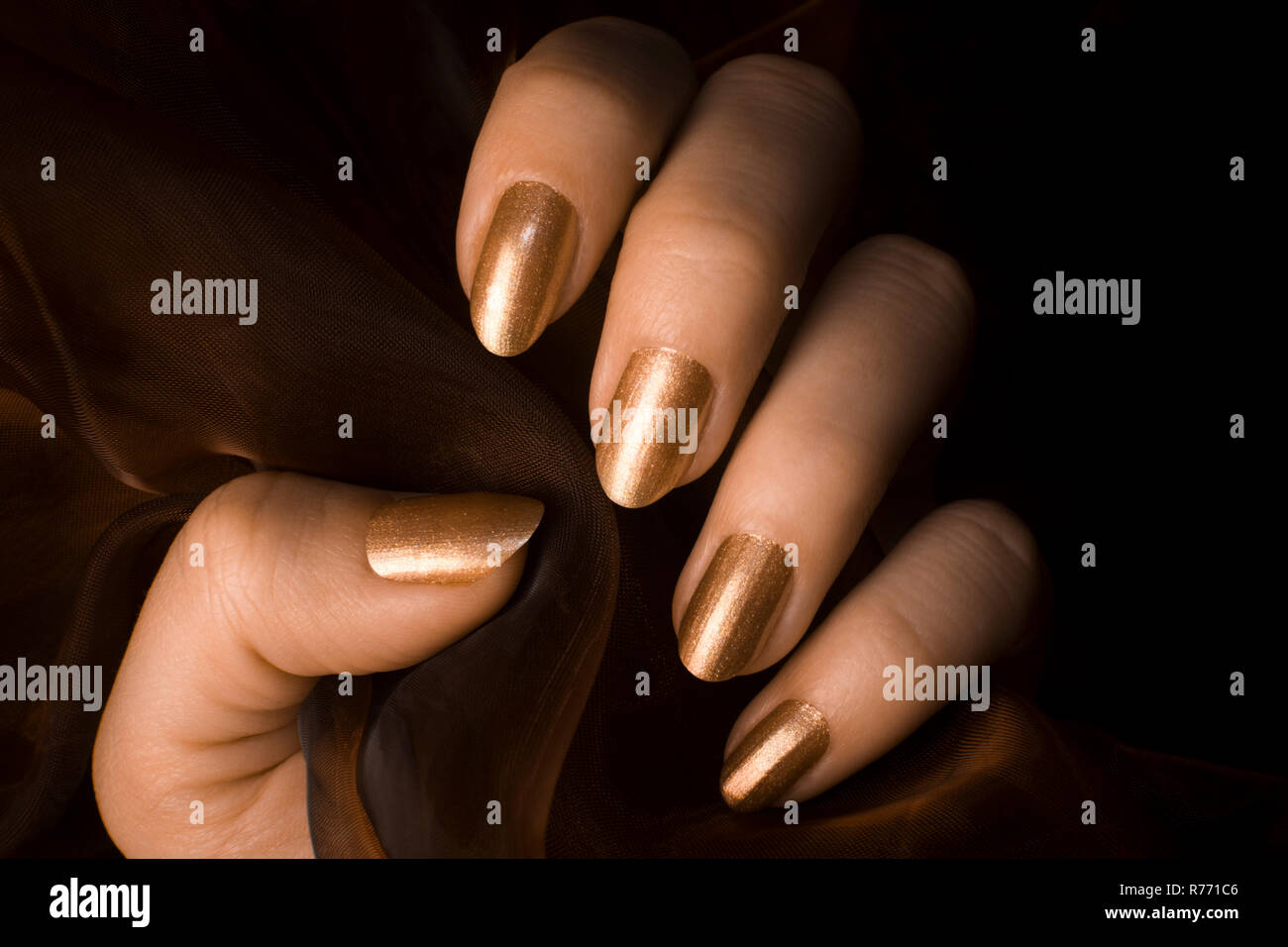shiny golden nails Stock Photo - Alamy