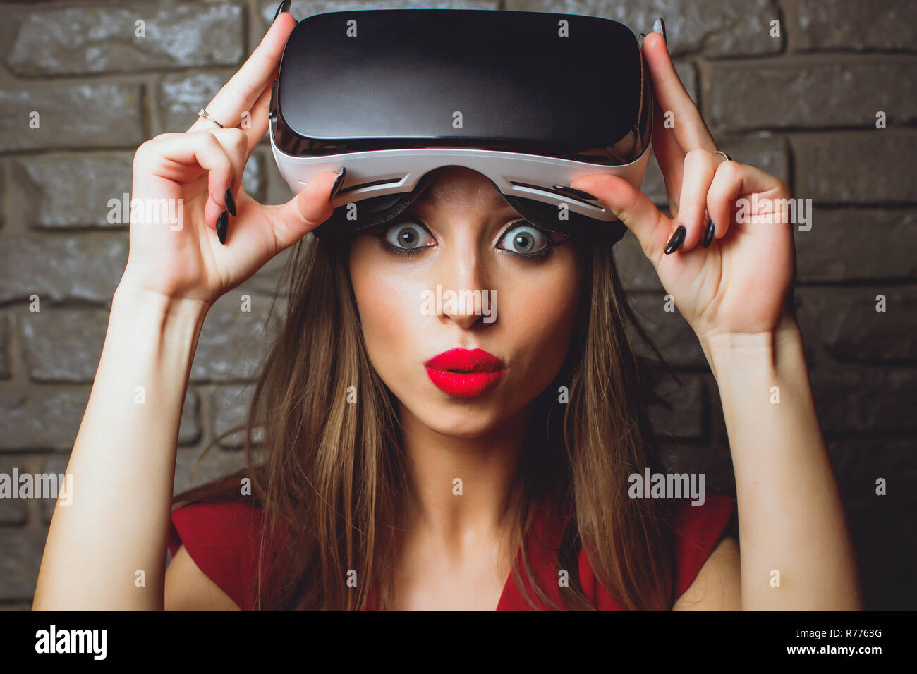 girl in red dress virtual glasses vr Stock Photo - Alamy