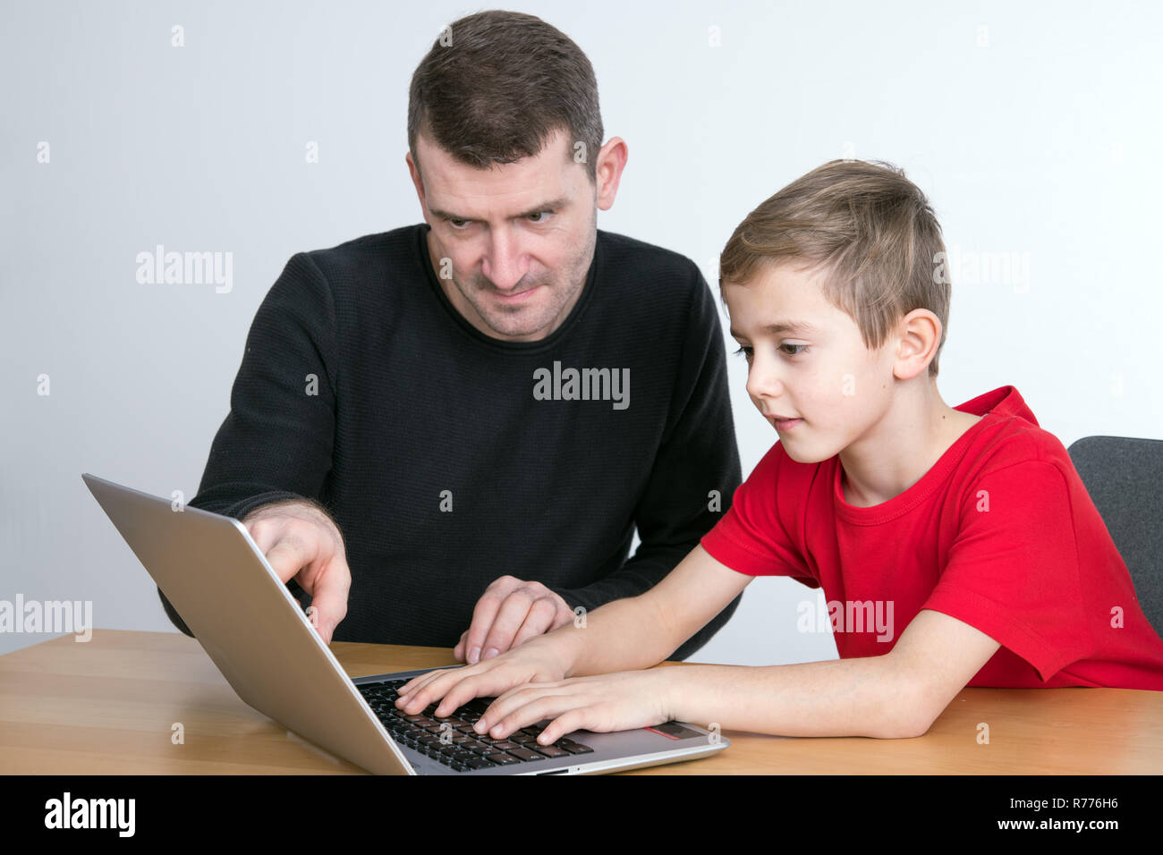 father and son using computer together Stock Photo - Alamy