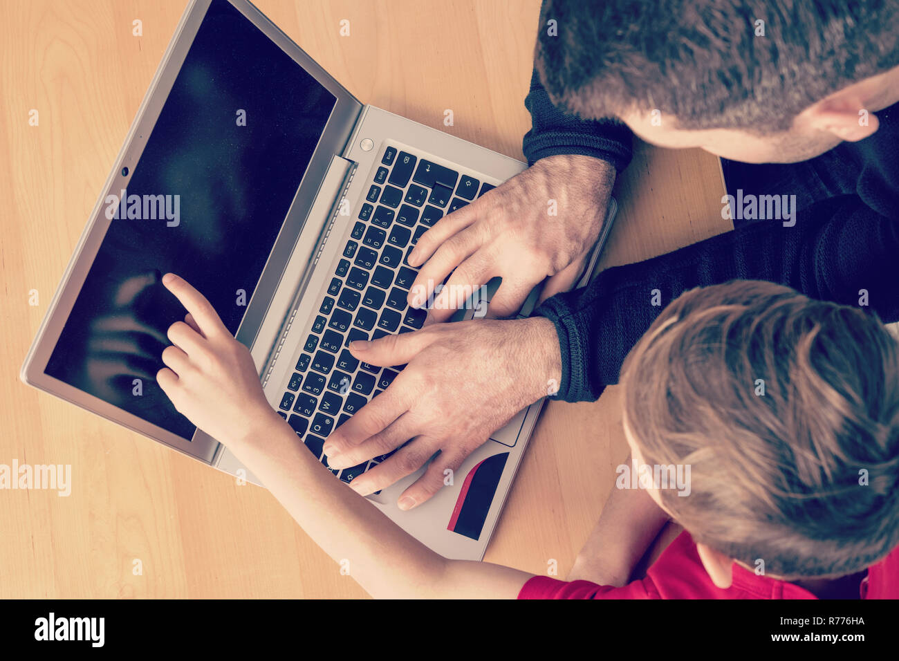 father and son using computer together Stock Photo - Alamy
