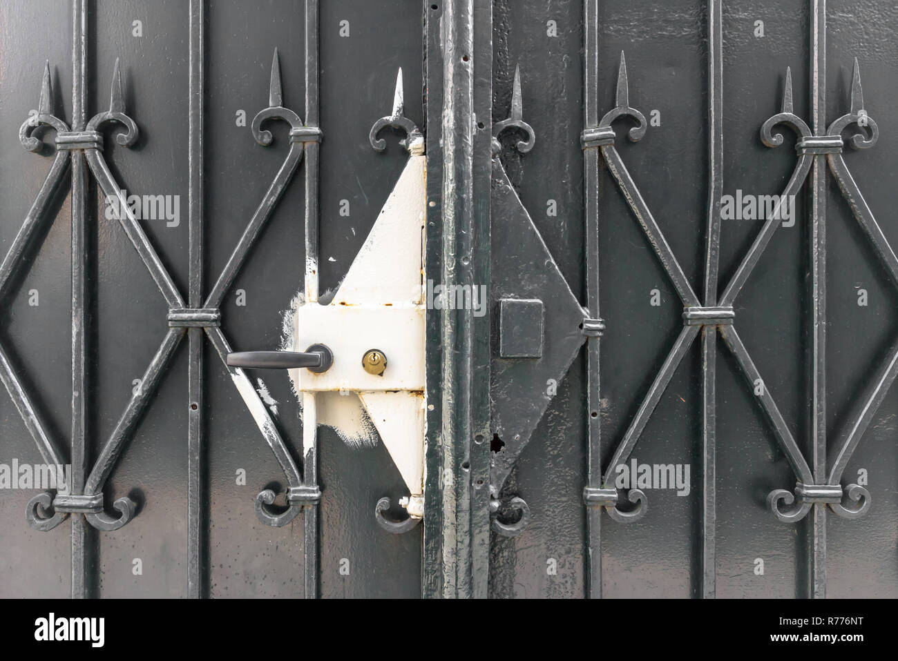 Forged Metal Gate and sealed Stock Photo - Alamy