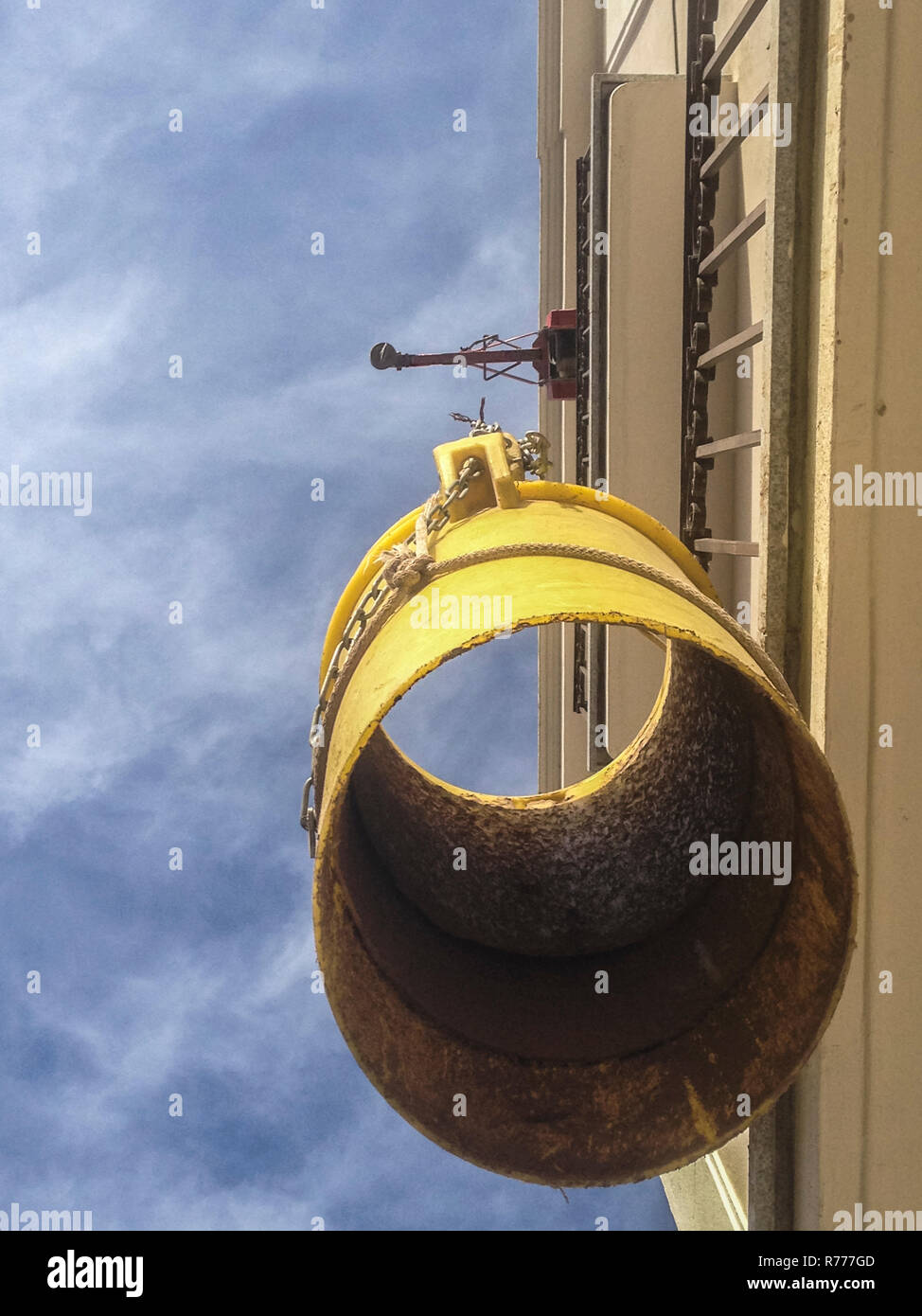 Garbage tube to dump debris at block building Stock Photo - Alamy
