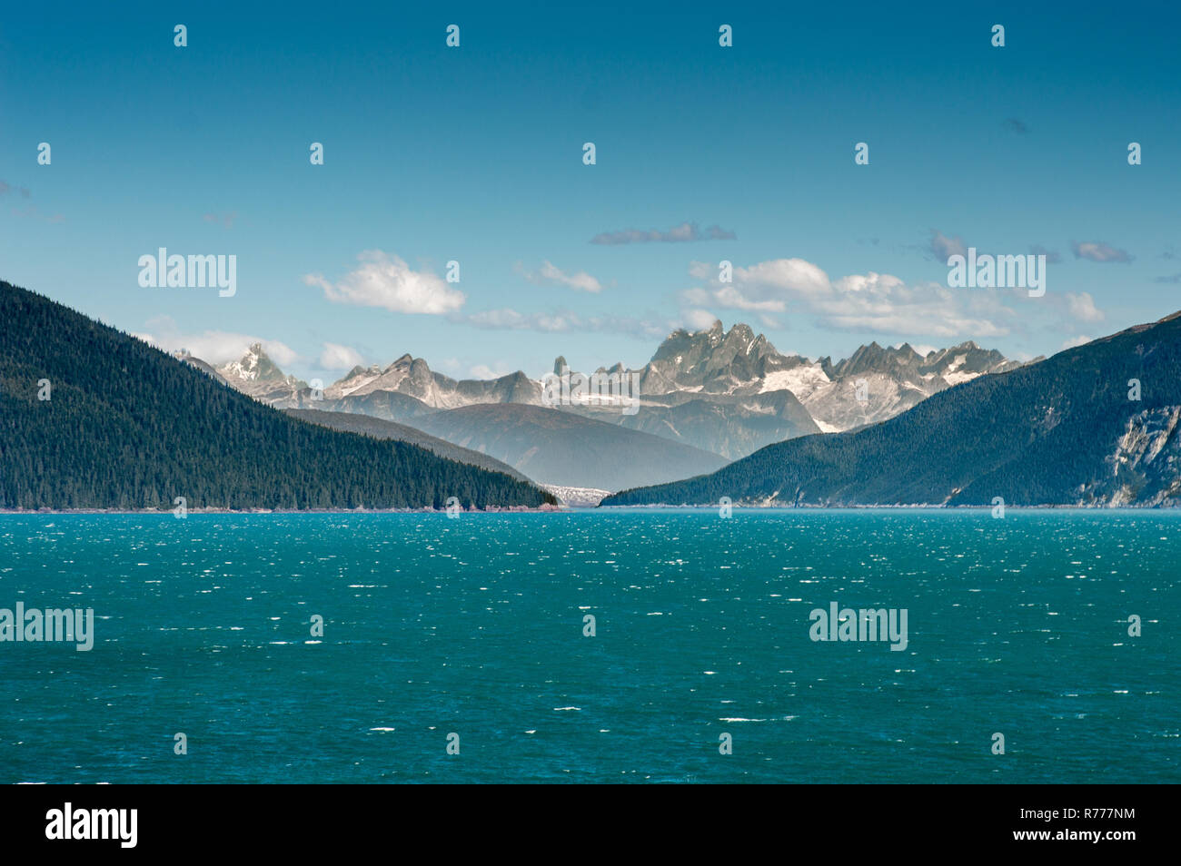 Entrance to the frigid and cold teal colored glacial waters of ...