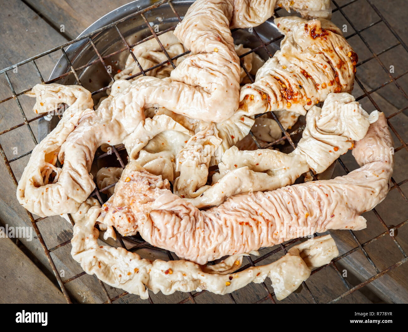 chitterlings pork entrails / grilled raw of chitterlings pork on grill ...