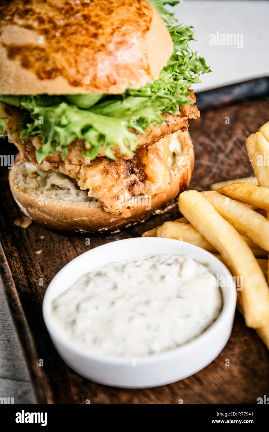 fish fillet burger with fries and tartar sauce set meal Stock Photo - Alamy