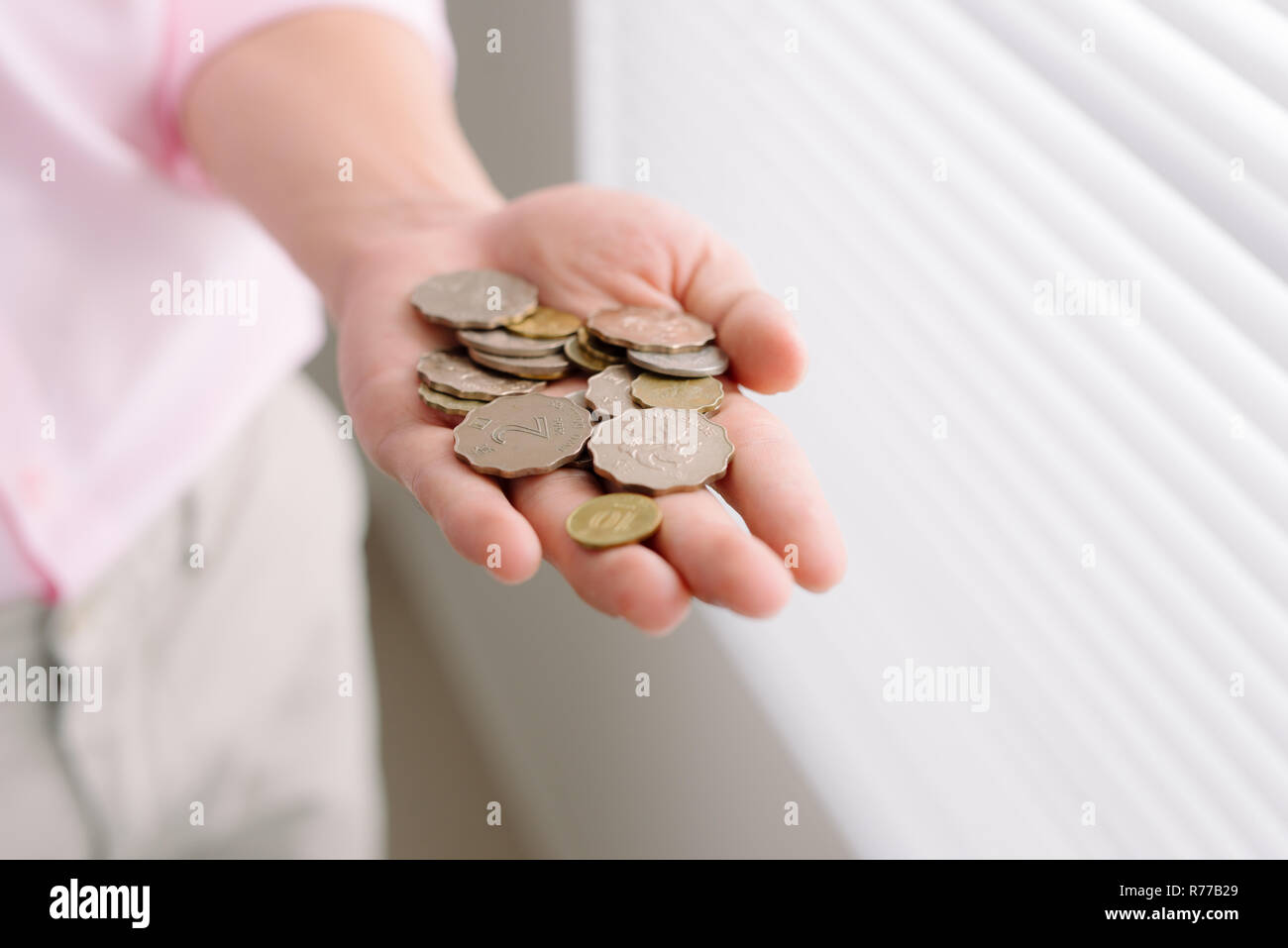 Hands counting coins hi-res stock photography and images - Alamy