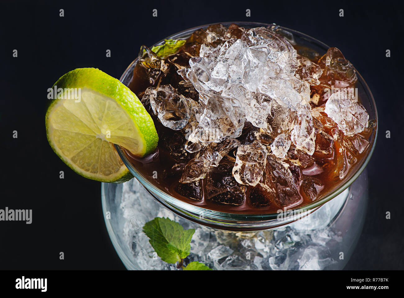 Espresso, mint and lime cocktail in a modern glass bowl. Coffee cold ...