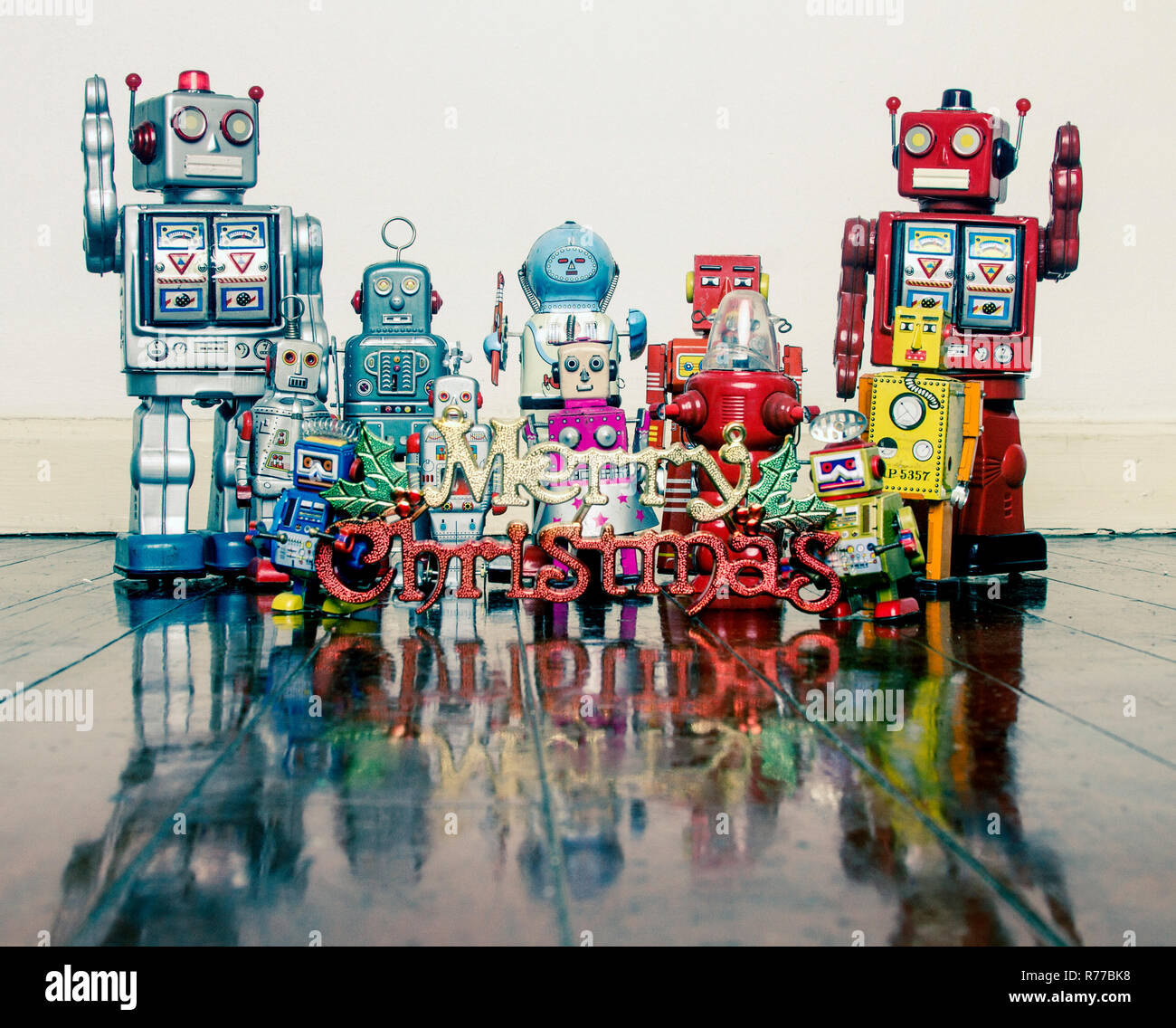 retro robots with gifts on a old wooden floor with reflection Stock ...