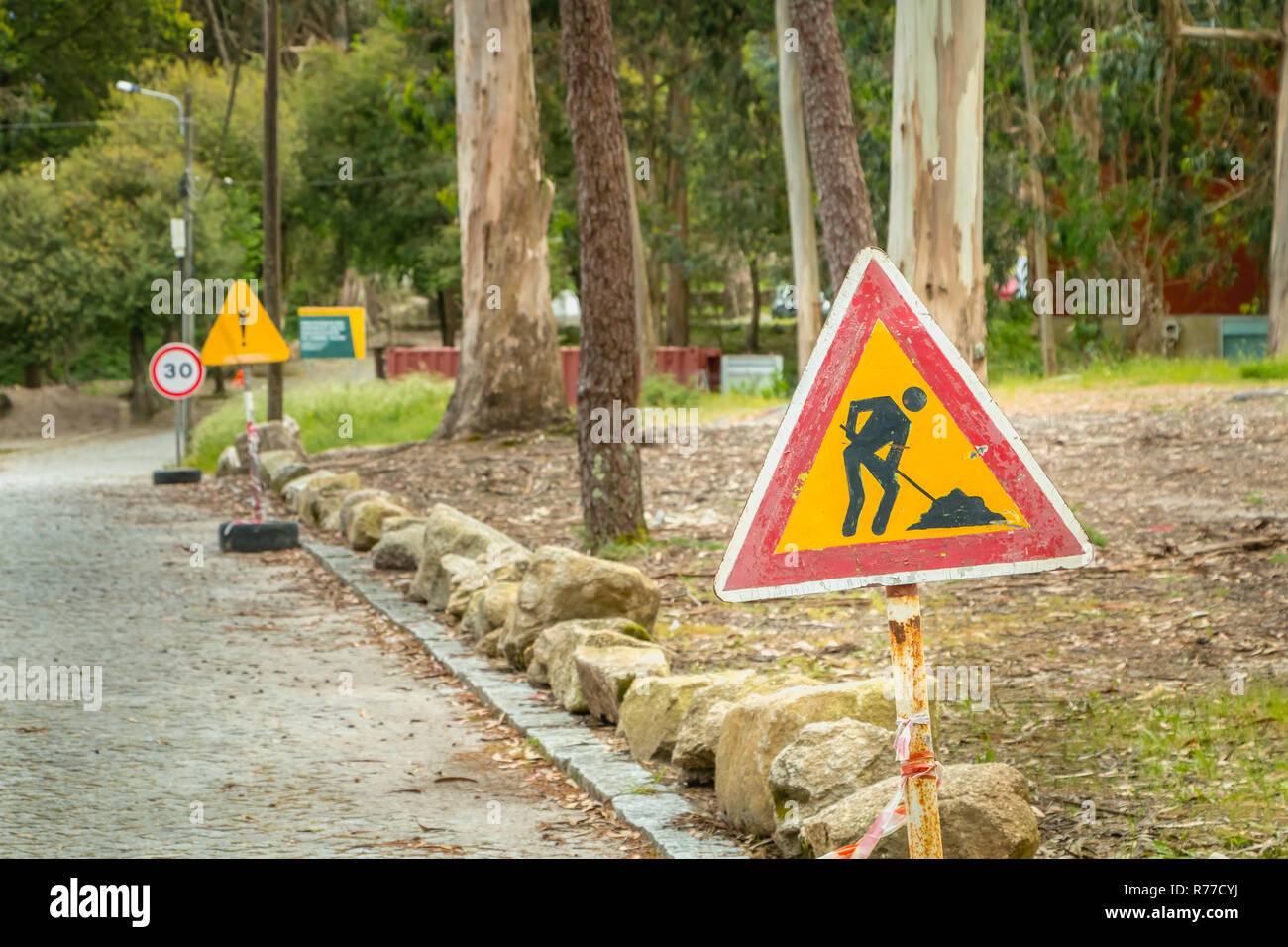 temporary road sign indicating work on a small road in the forest Stock ...