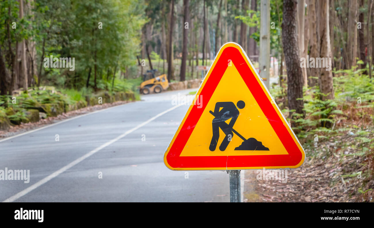 temporary road sign indicating work on a small road in the forest Stock ...