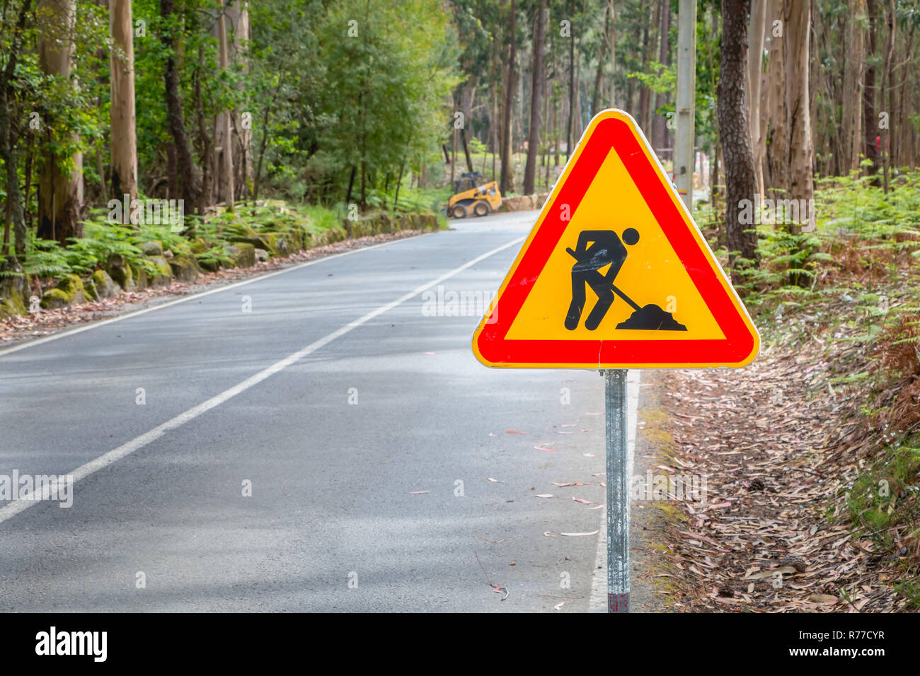 temporary road sign indicating work on a small road in the forest Stock ...